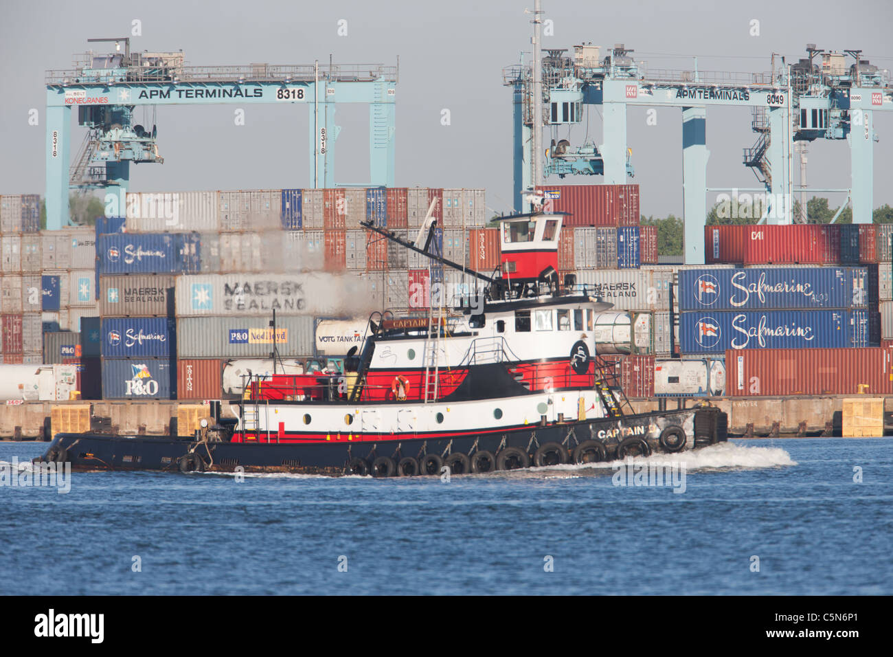 A Norfolk Tug tugboat passes the A.P. Moller–Maersk facility in the ...