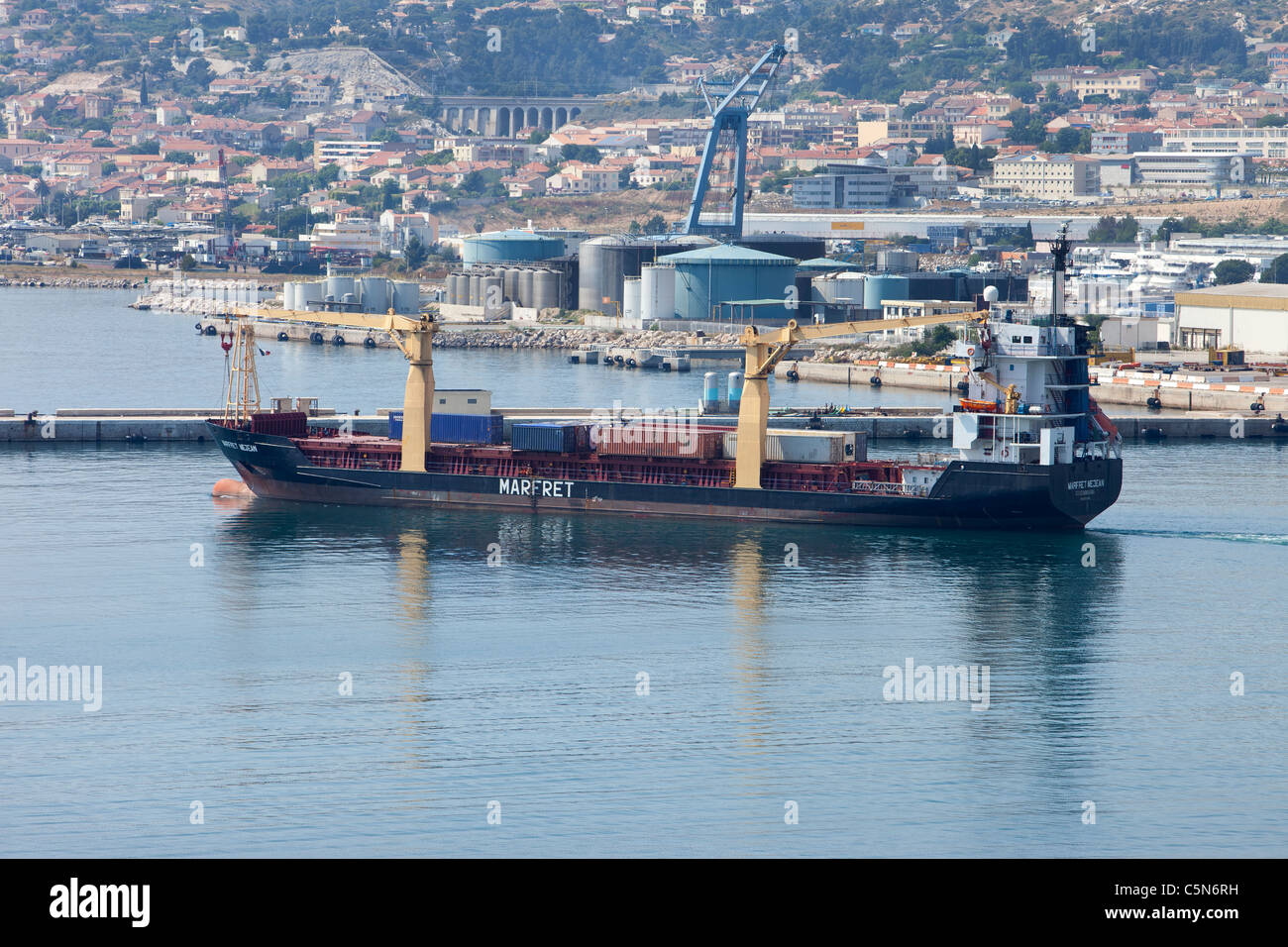 Marsielles, France city with a cargo ship, homes, apartments ...