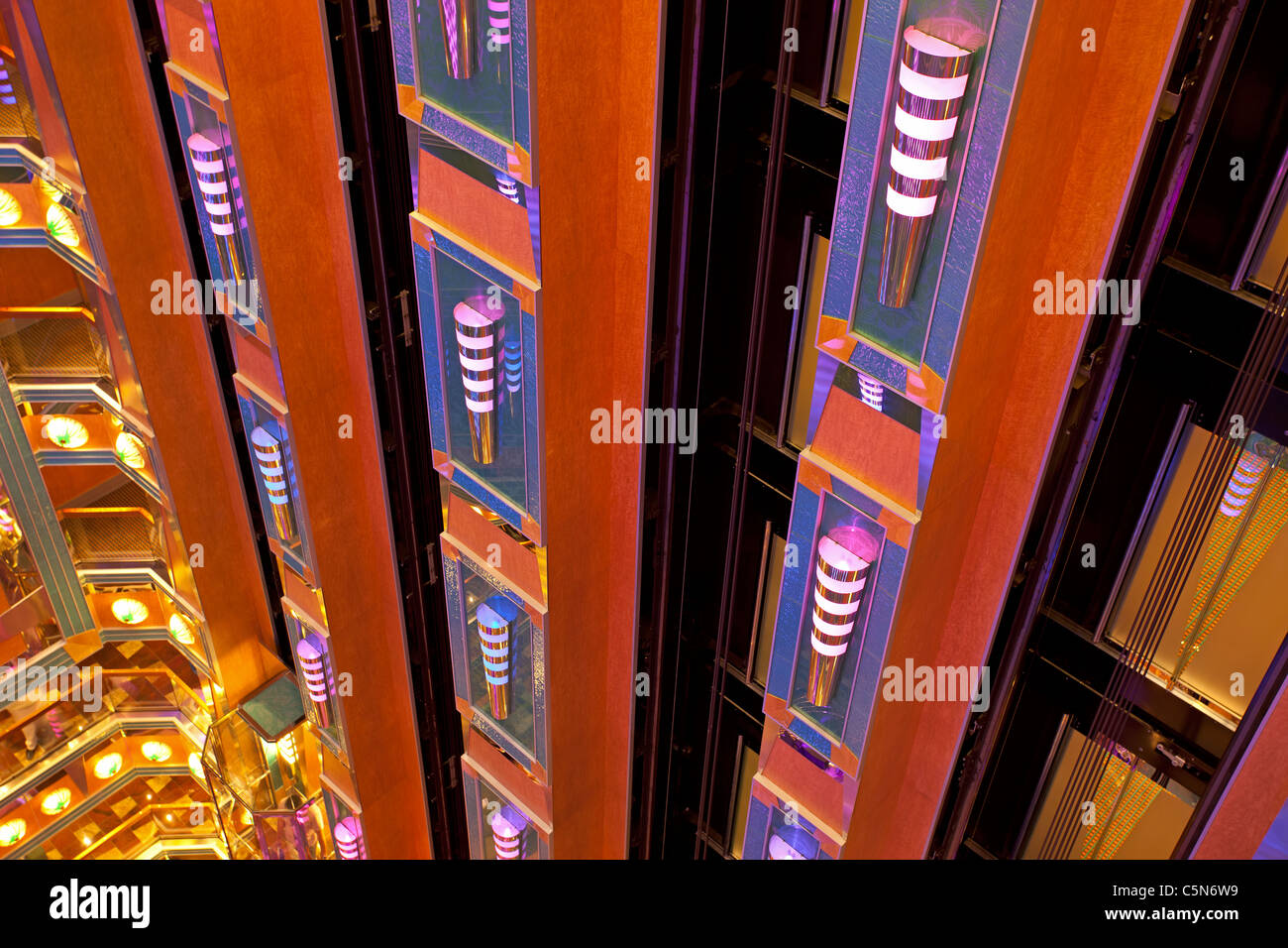 Cruise ship interior atrium glass elevators. Bright and glitter with ...