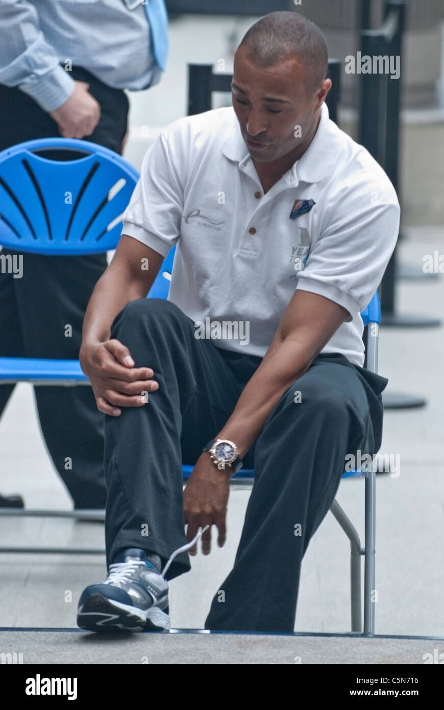 Colin Jackson British former sprint and hurdler puts on running shoe St ...