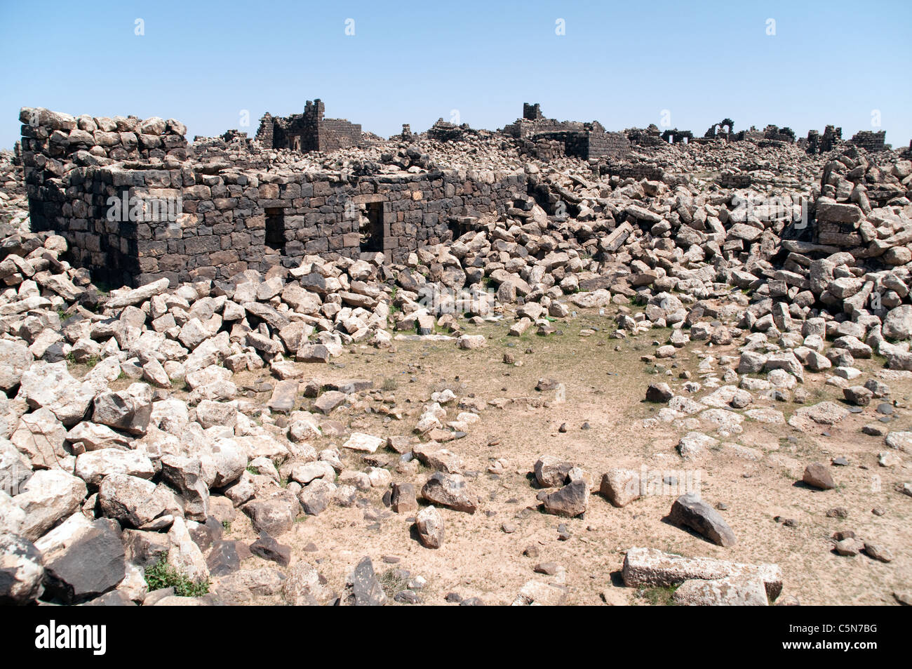 Basalt stone ruins in the ancient city and archaeological site of Umm ...