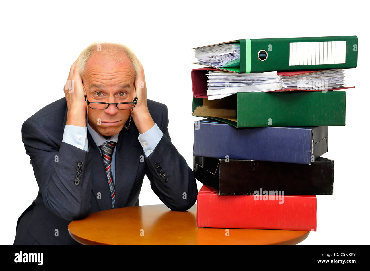 Worker with stack of files isolated in white Stock Photo - Alamy