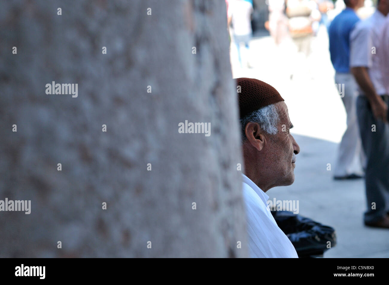 Man reflecting on meaning of life in courtyard of New Mosque, Istanbul ...