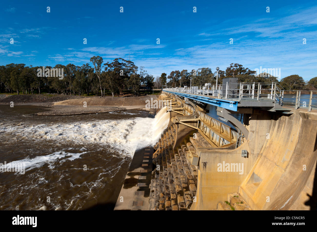 A weir releasing water for irrigation of farm land Stock Photo - Alamy