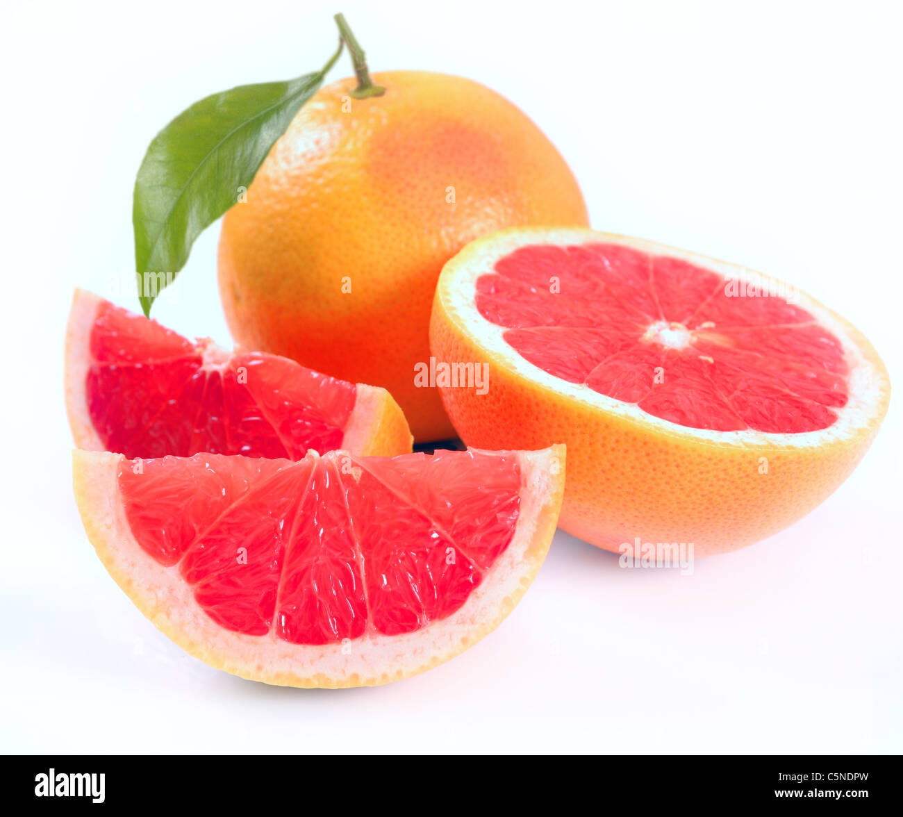 Grapefruit with segments on a white background Stock Photo - Alamy