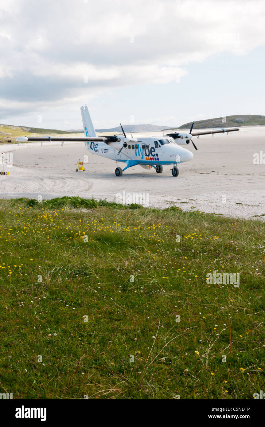A de Havilland DHC-6 Twin Otter plane of Flybe - Loganair on the beach ...