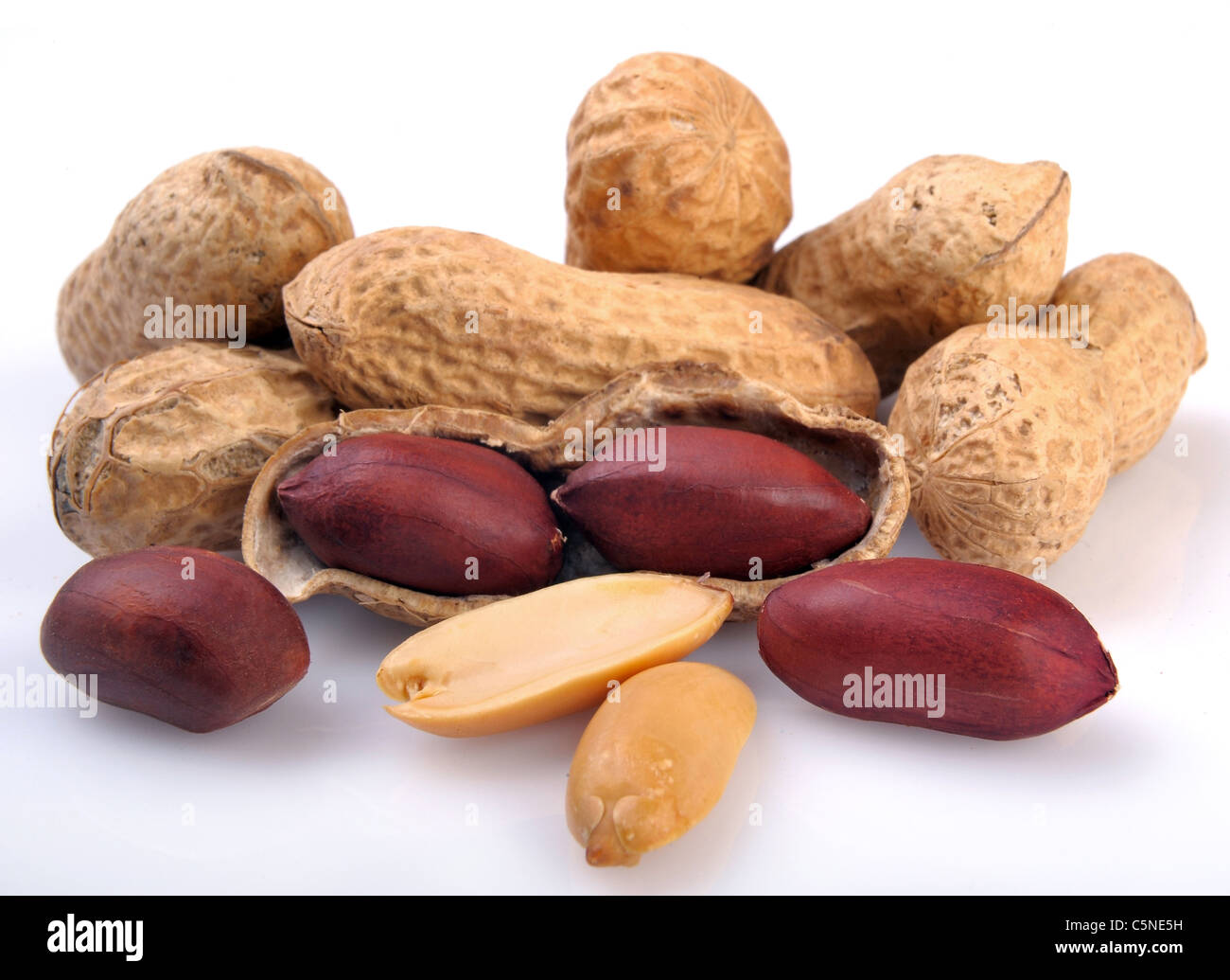 Peanut in a shell and cleared on a white background Stock Photo - Alamy