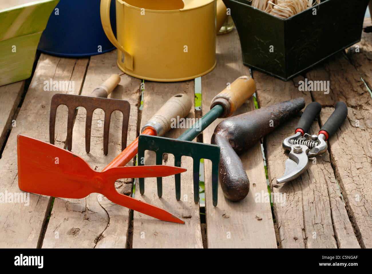 Little tools of the garden : little rake, little hoe, tool for planting ...