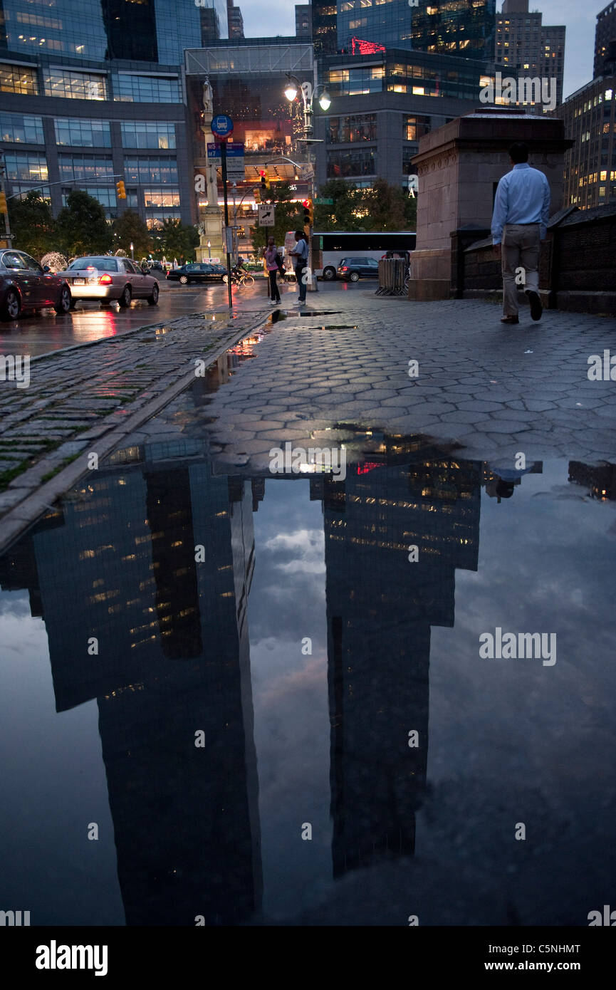 Pair of New York skyscraper's relfected in a water giving echos of 911 ...