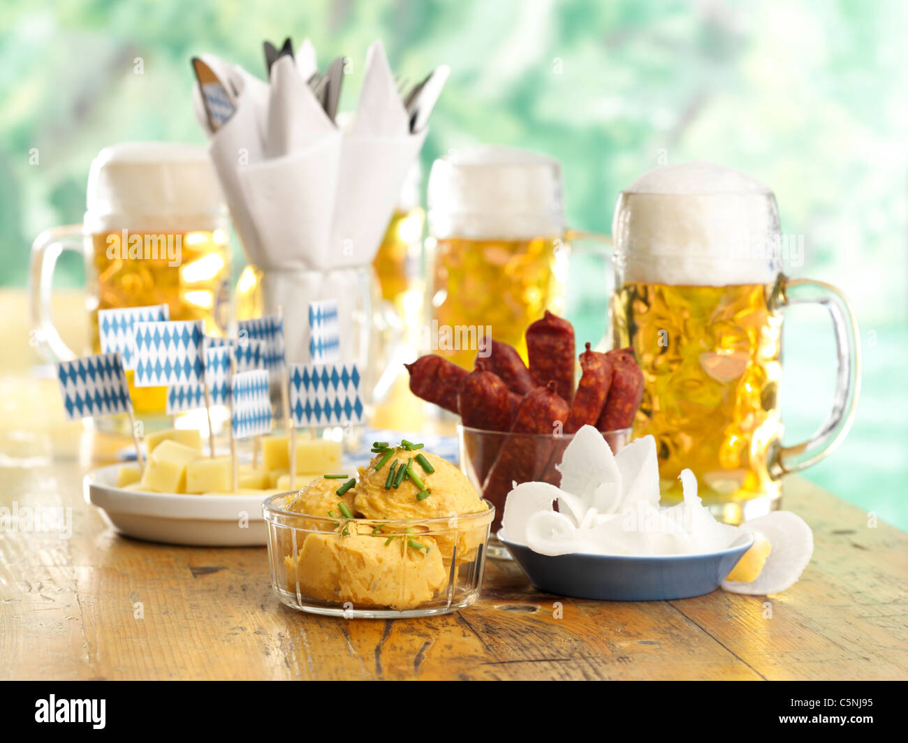 Bavarian cheese spread, sausages, cheese sticks and white radish Stock ...