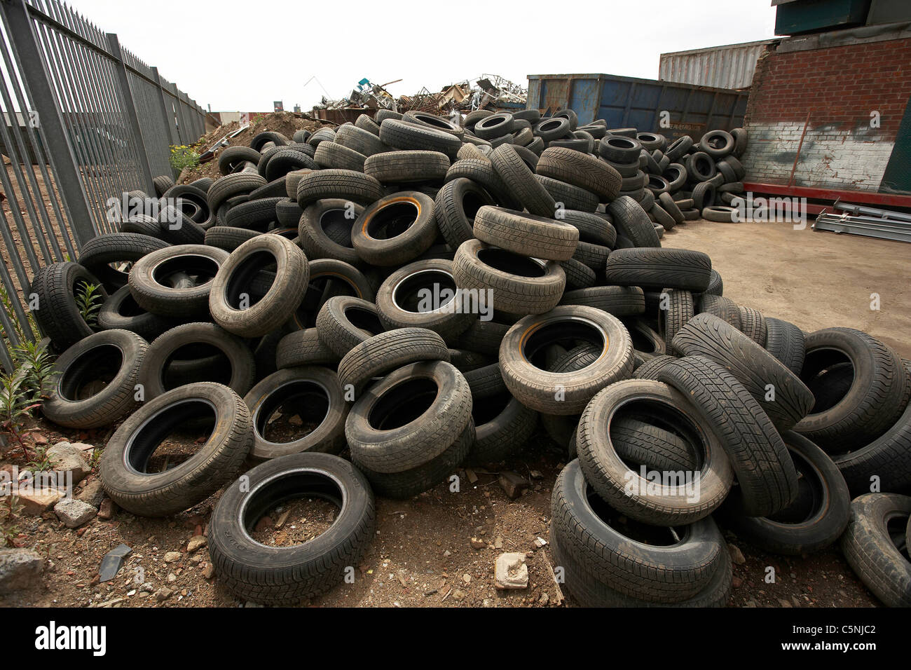 Old tyres ready for recycling in a scrapyard, uk Stock Photo - Alamy