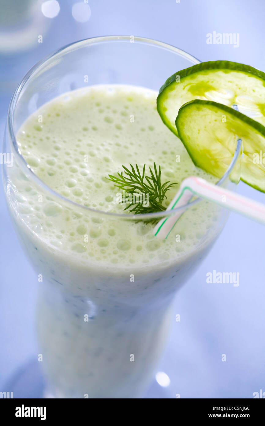 Cucumber shake with straw Stock Photo - Alamy
