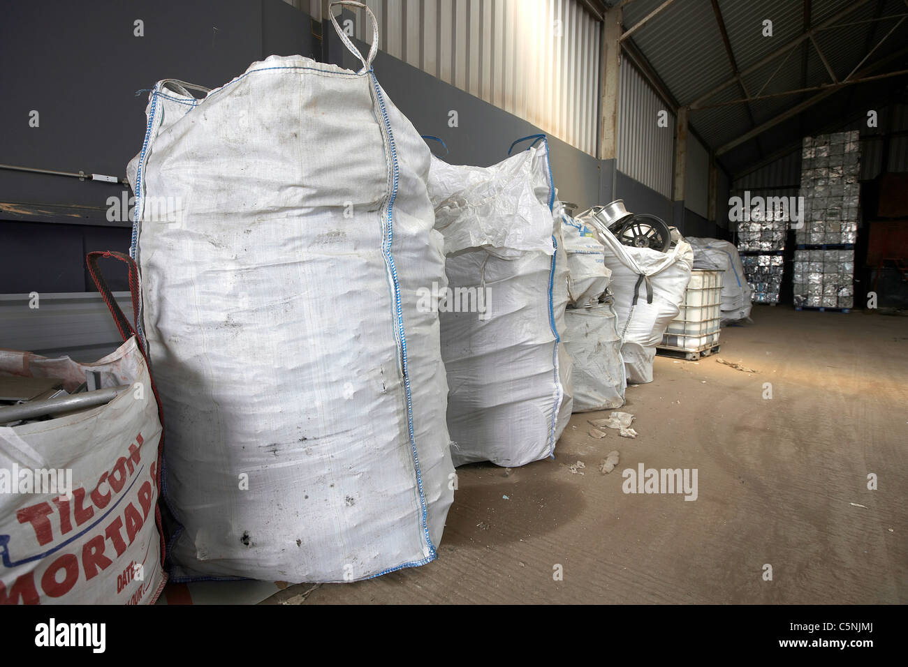 Sacks of scrap ready for recycling in a scrapyard, uk Stock Photo - Alamy