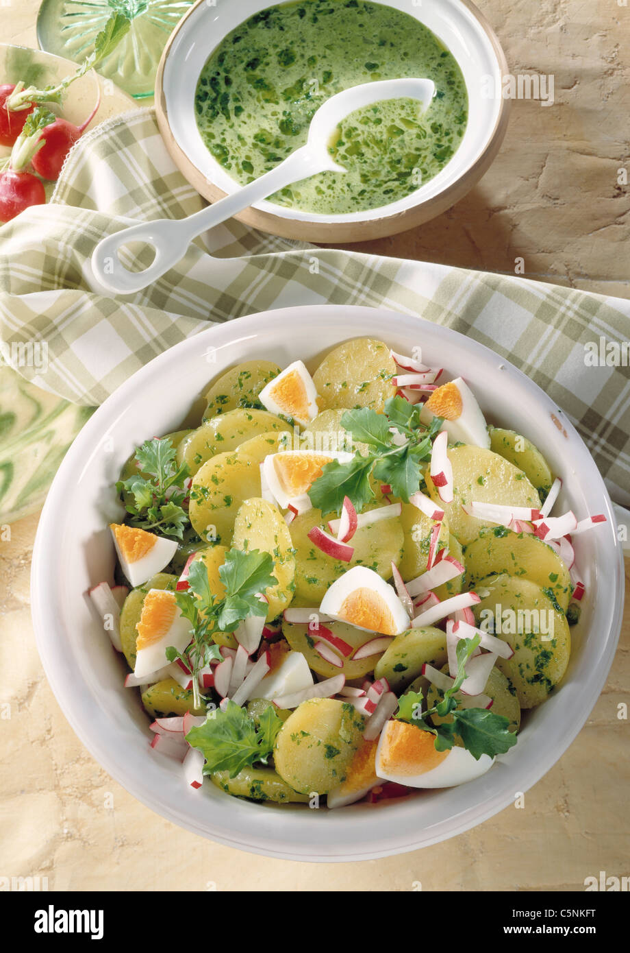 Potato salad with rocket dressing and eggs Stock Photo - Alamy
