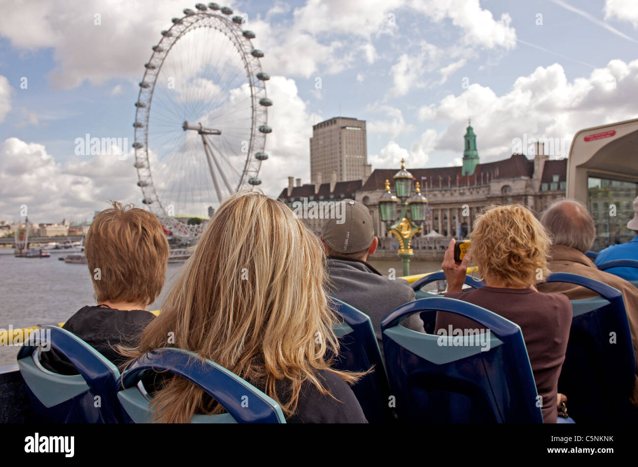 Tourists on an open-top bus tour of London, UK Stock Photo - Alamy