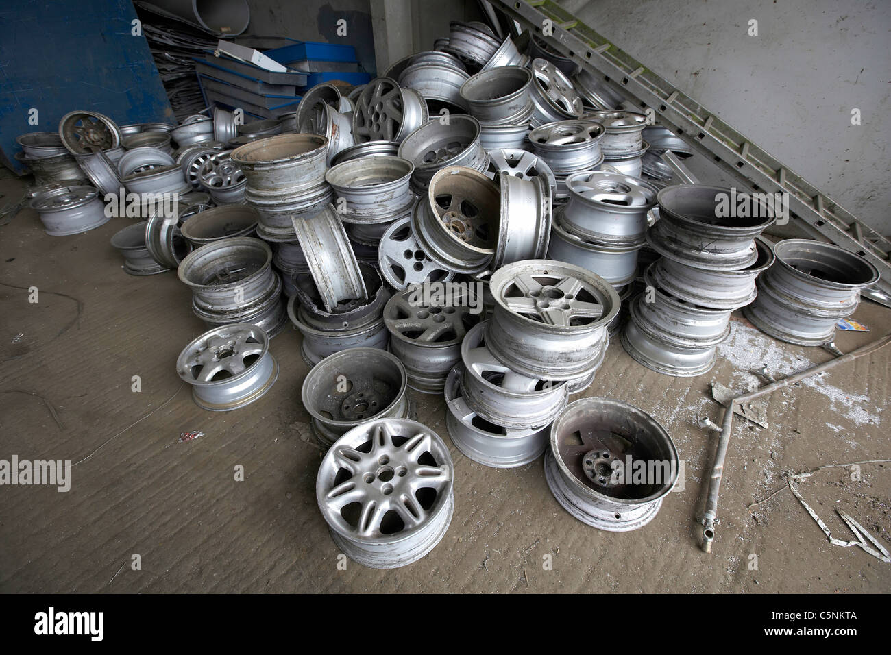 Alloy wheels ready for recycling in a scrapyard, uk Stock Photo - Alamy