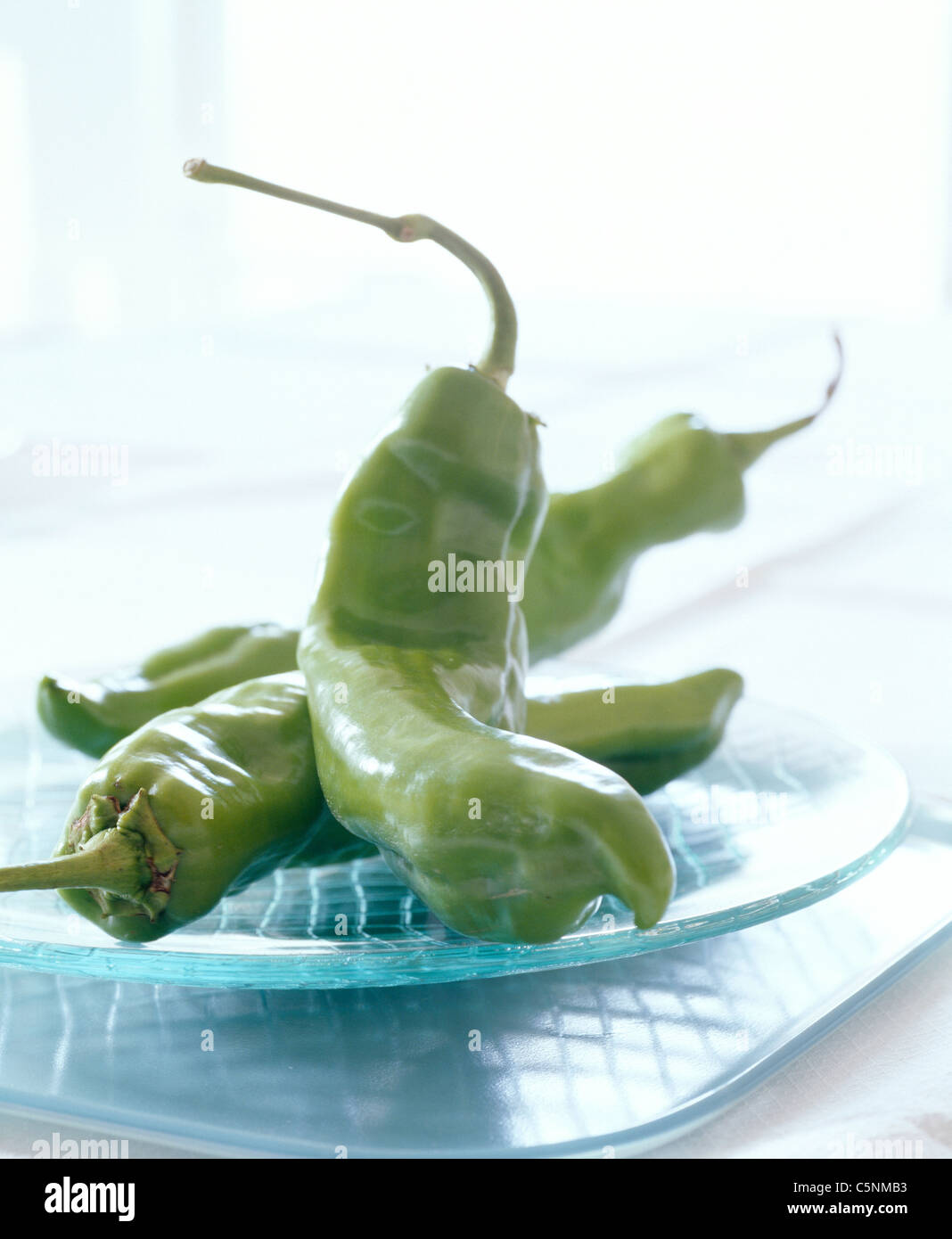 Three green chili pods Stock Photo - Alamy
