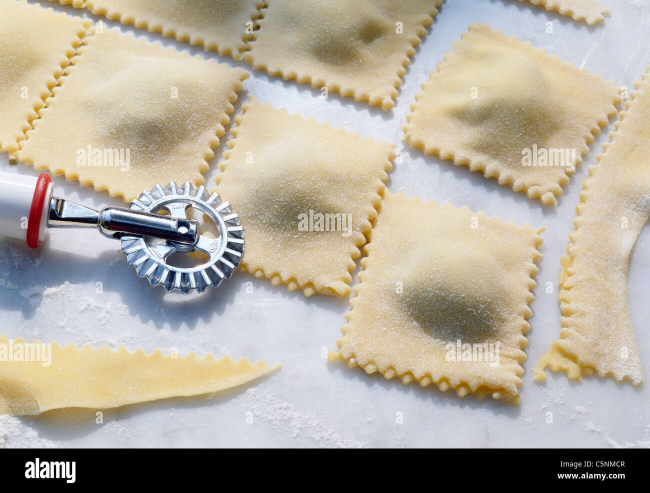 Cutting filled ravioli Stock Photo - Alamy