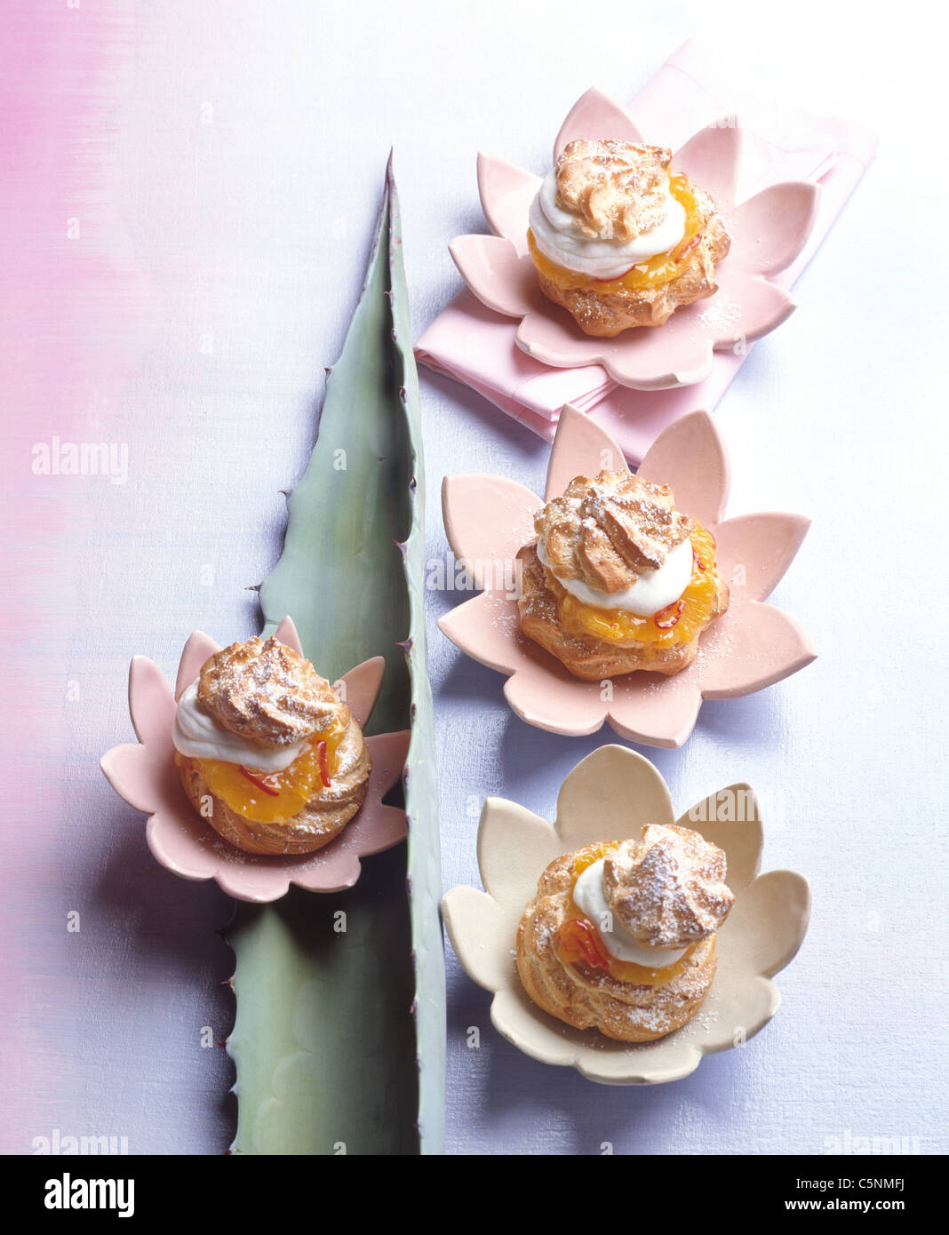 Cream puff with orange slices and spicy cream Stock Photo - Alamy