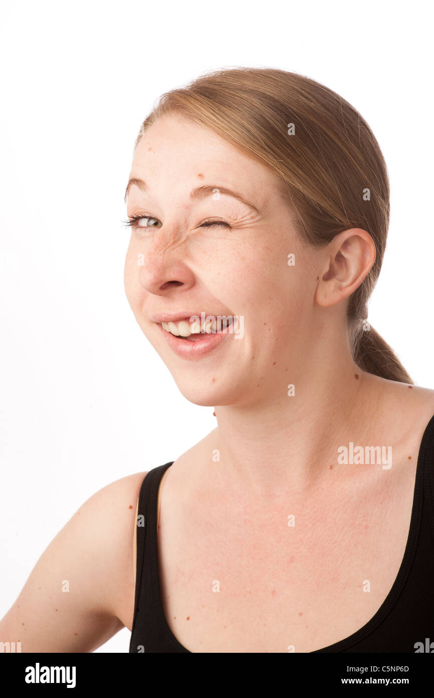 a young caucasian woman winking with her left eye Stock Photo - Alamy