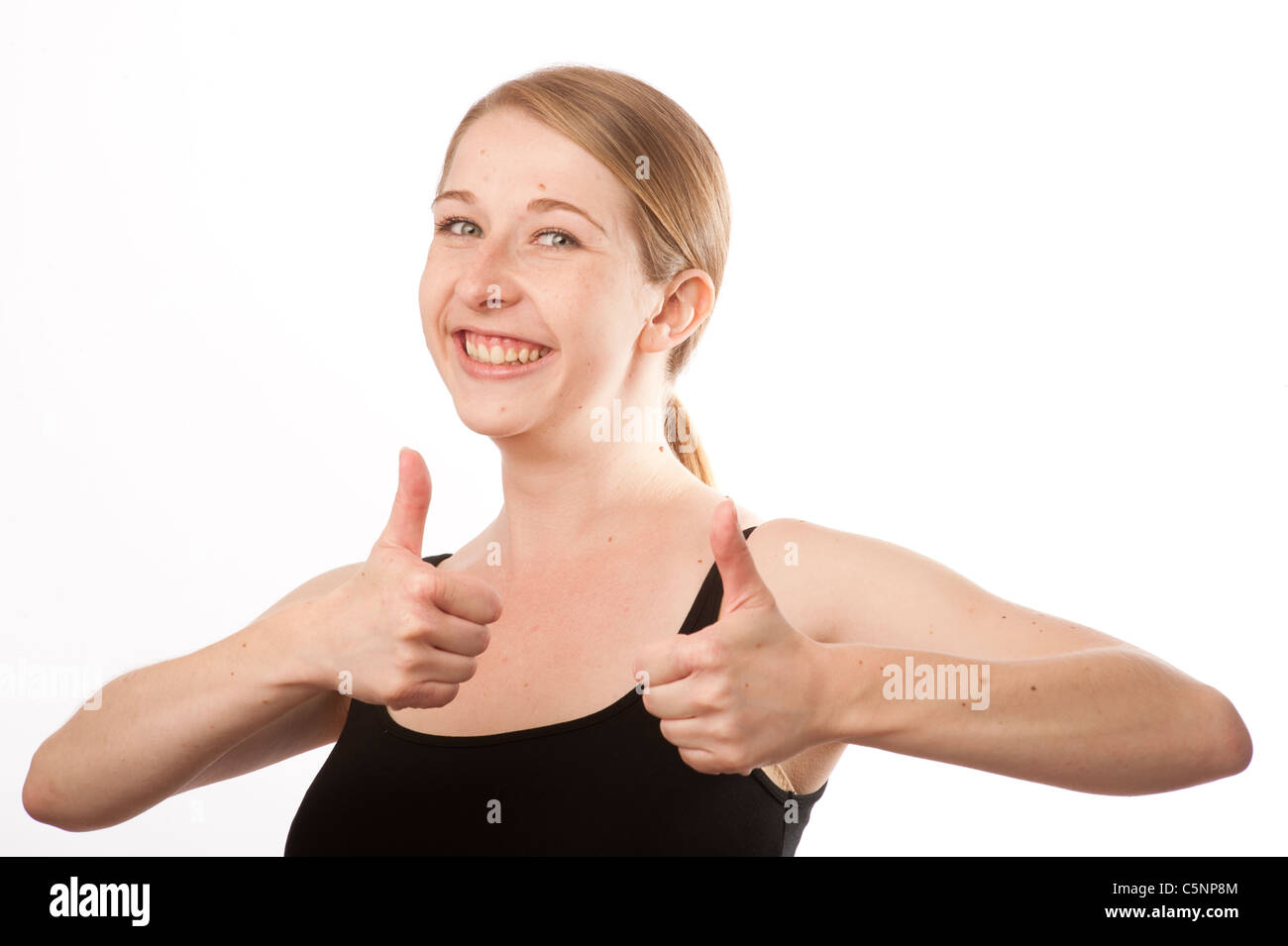 a young caucasian woman with her two thumbs up looking positive, uk ...