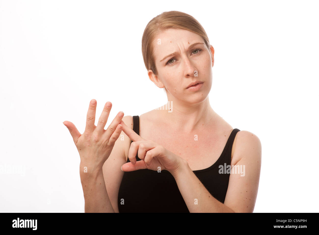 a young caucasian woman counting on the fingers of one hand Stock Photo ...