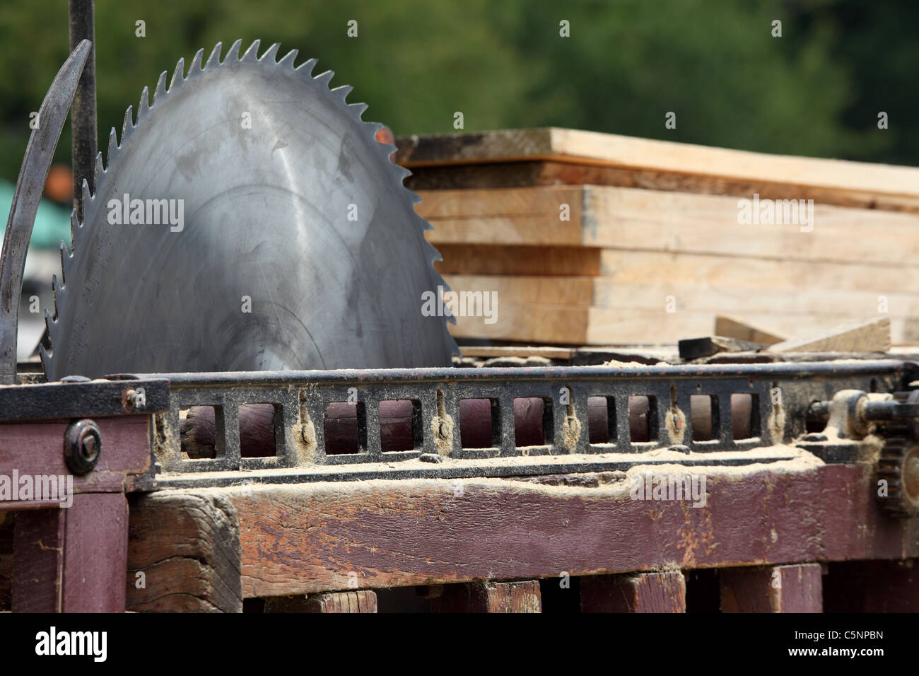 A saw bench powered by A steam traction engine Stock Photo - Alamy