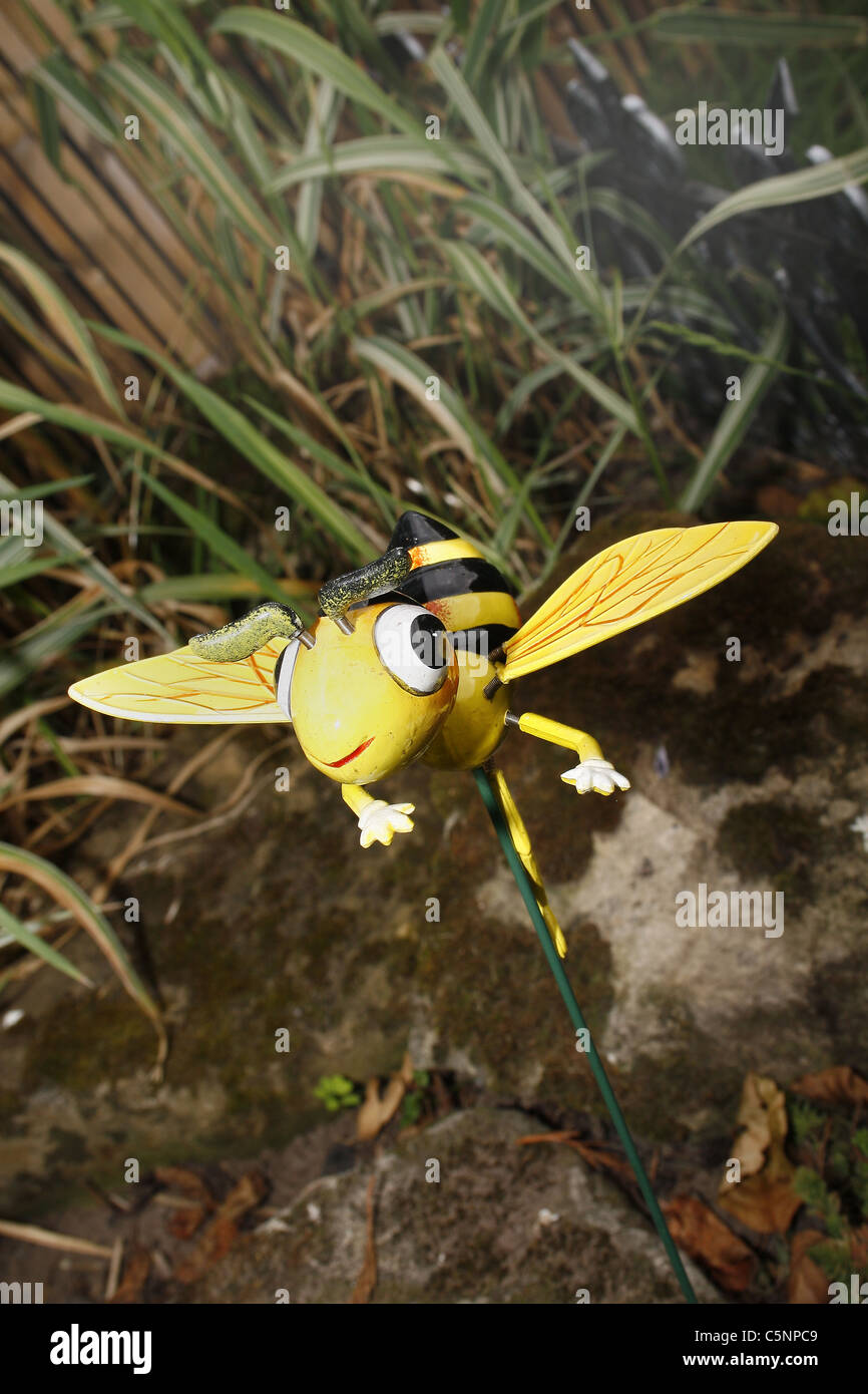 image of plastic bee ornament in garden Stock Photo - Alamy