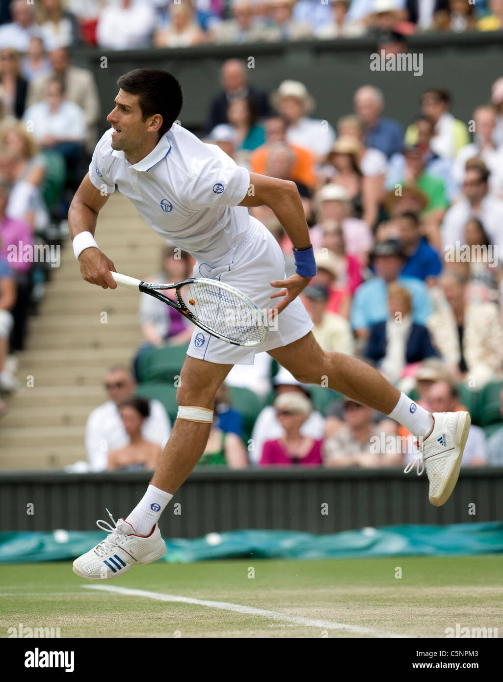 Novak Djokovic (SRB) in action during the Wimbledon Tennis ...