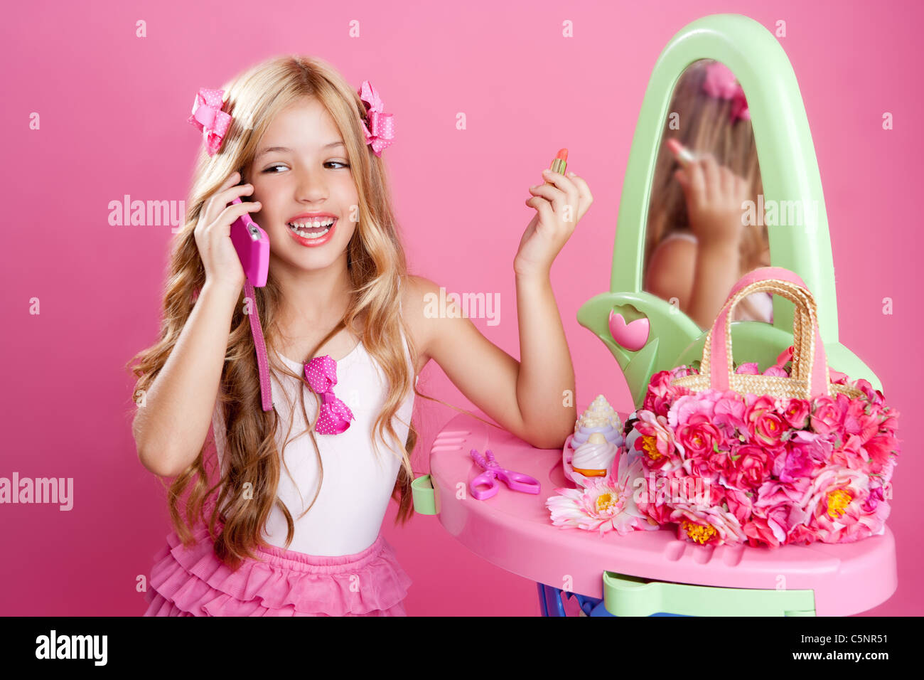 Children fashion doll blond girl talking mobile phone in pink vanity ...