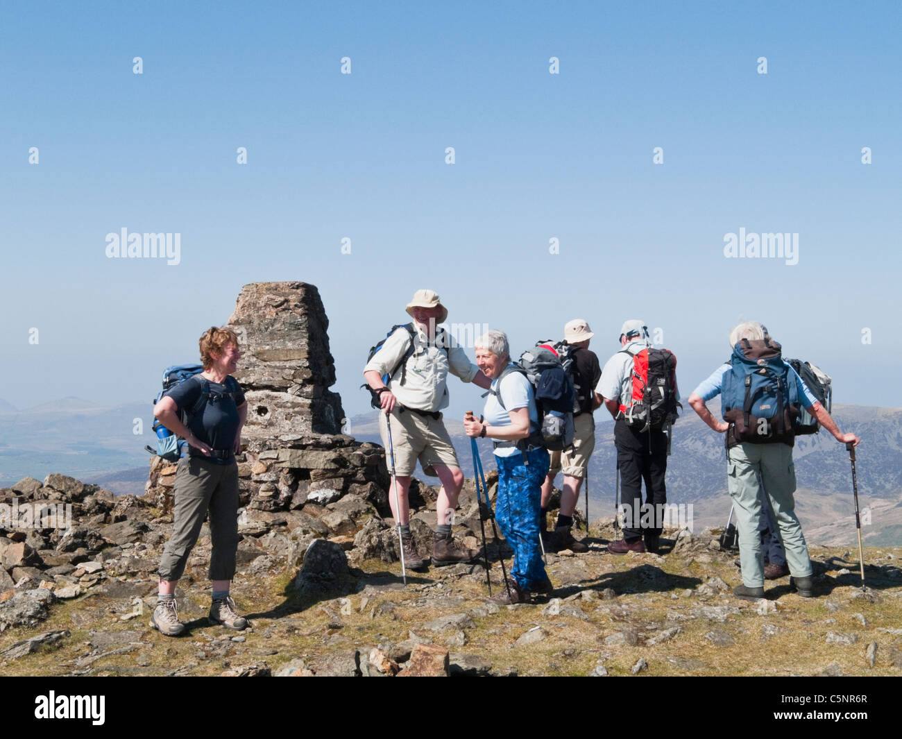 Welsh Ramblers group enjoying a rest on summit of Moel Hebog in Welsh ...