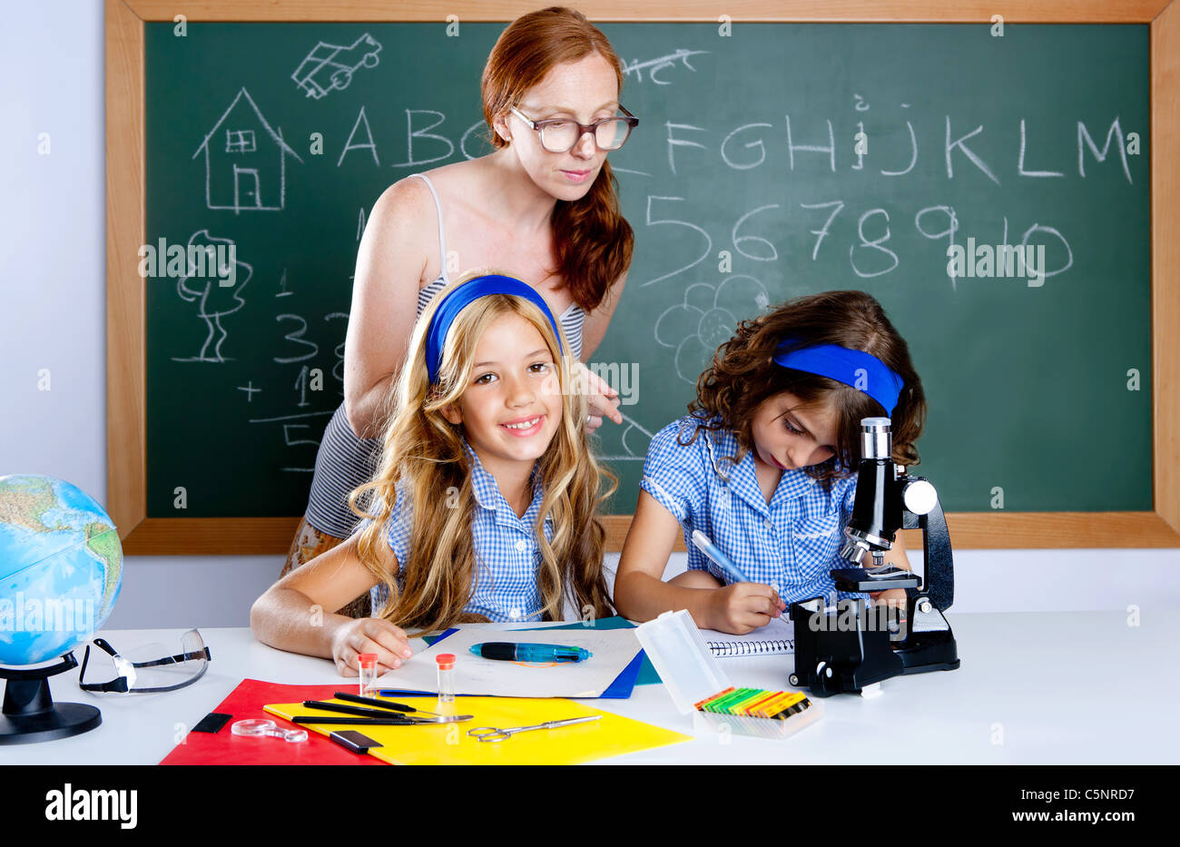 kids students with nerd teacher woman at school classroom Stock Photo ...