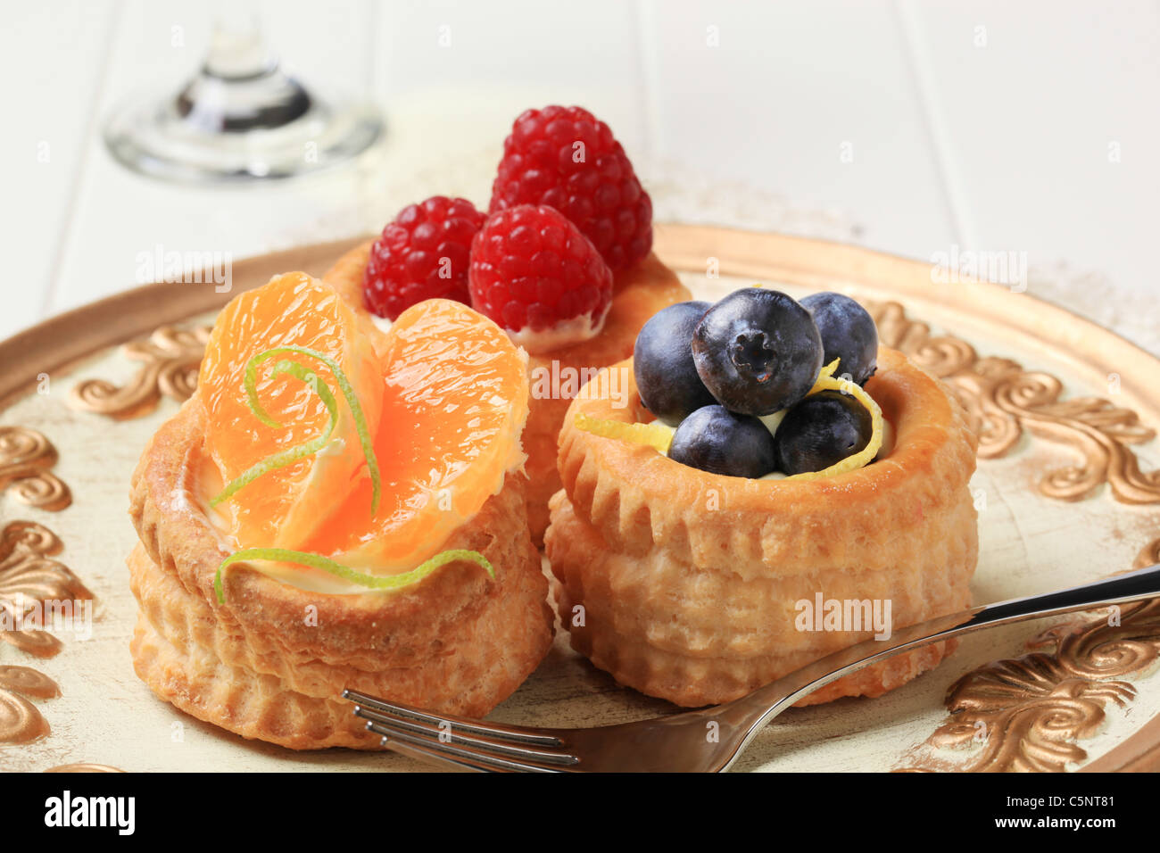 Puff pastry shells filled with custard and fresh fruit Stock Photo - Alamy