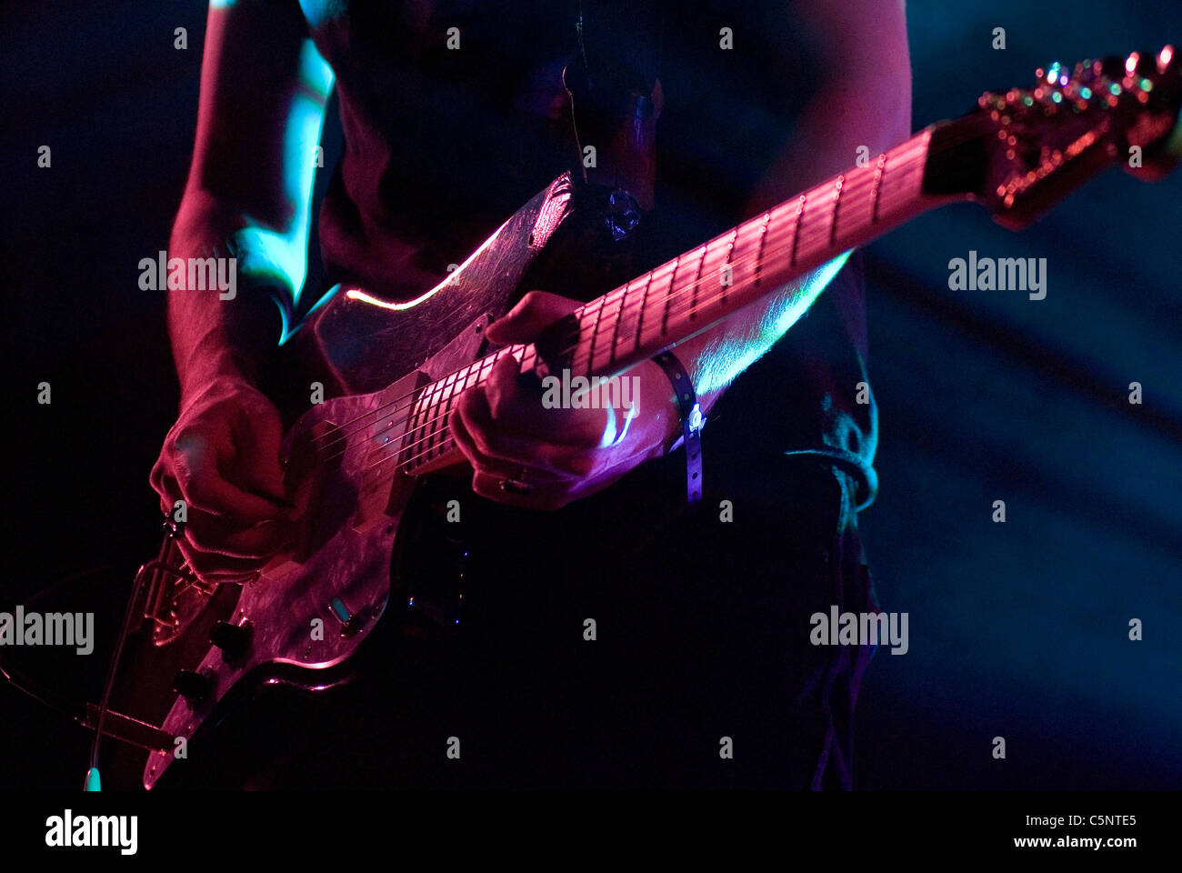 Guitarist playing at a music gig Stock Photo - Alamy