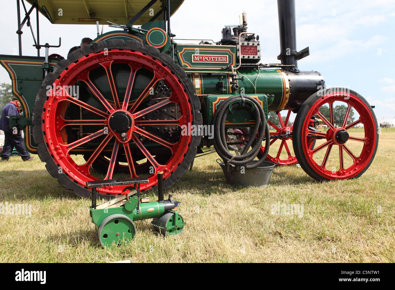 A scale model and A big steam traction engine Stock Photo - Alamy