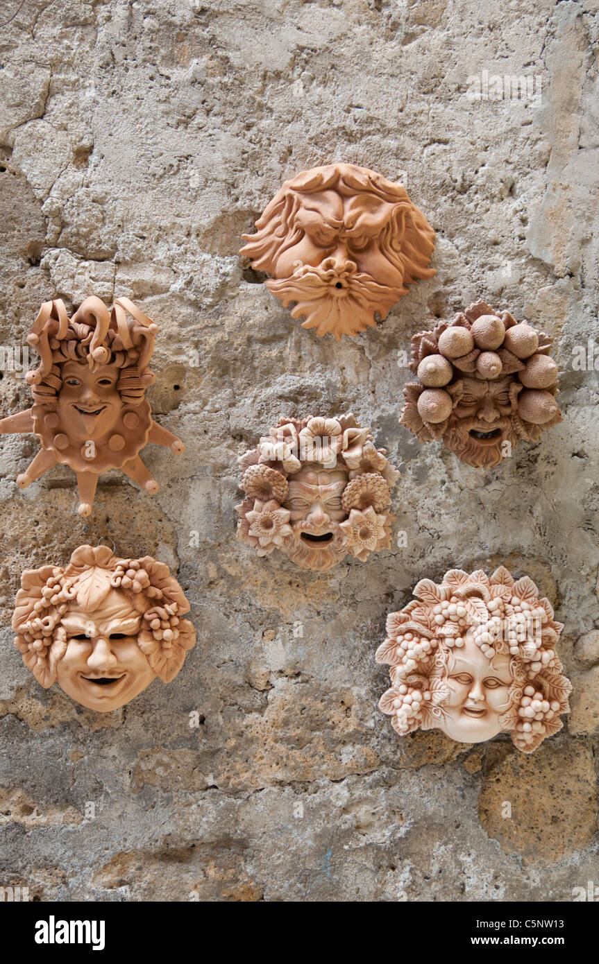 Terracotta masks adorn a wall in Orvieto Stock Photo - Alamy