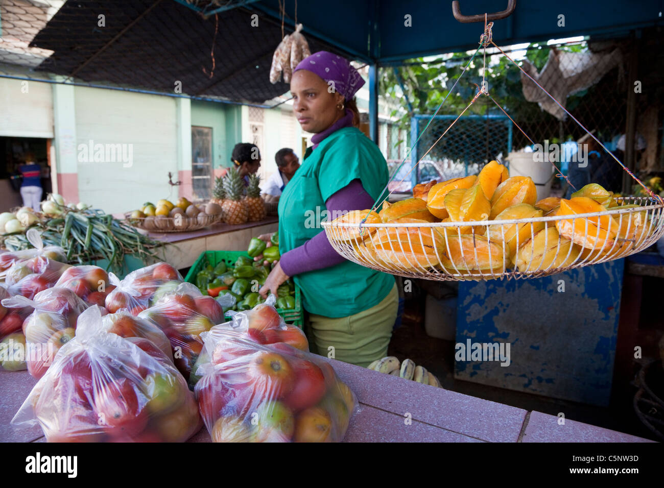 Cuba, Havana. Neighborhood Fruit, vegetable, and Meat Stand. Star fruit ...