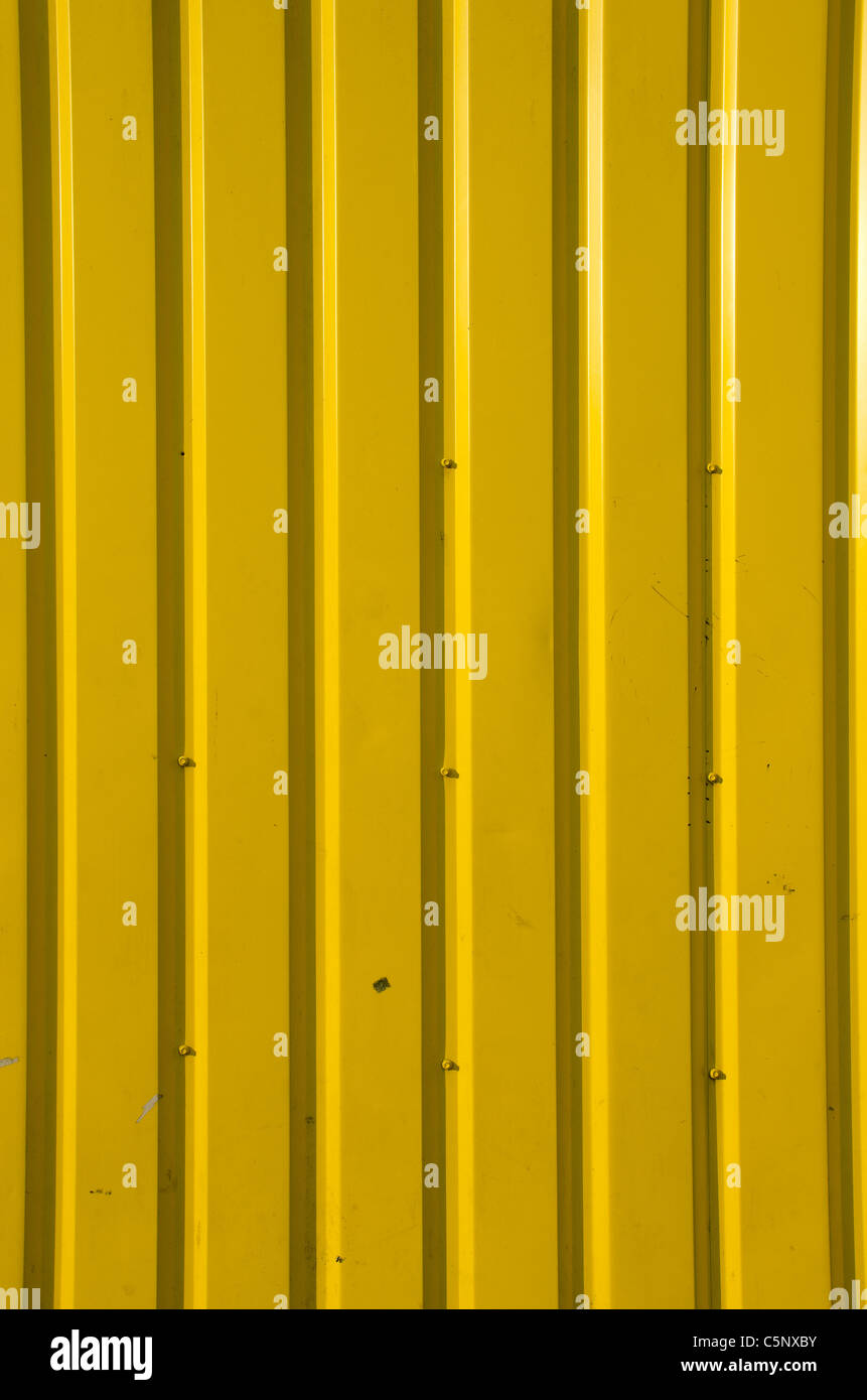 yellow painted metal wall background and texture Stock Photo - Alamy