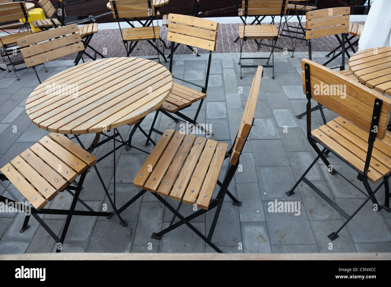 Empty terrace - table and folding chair Stock Photo - Alamy