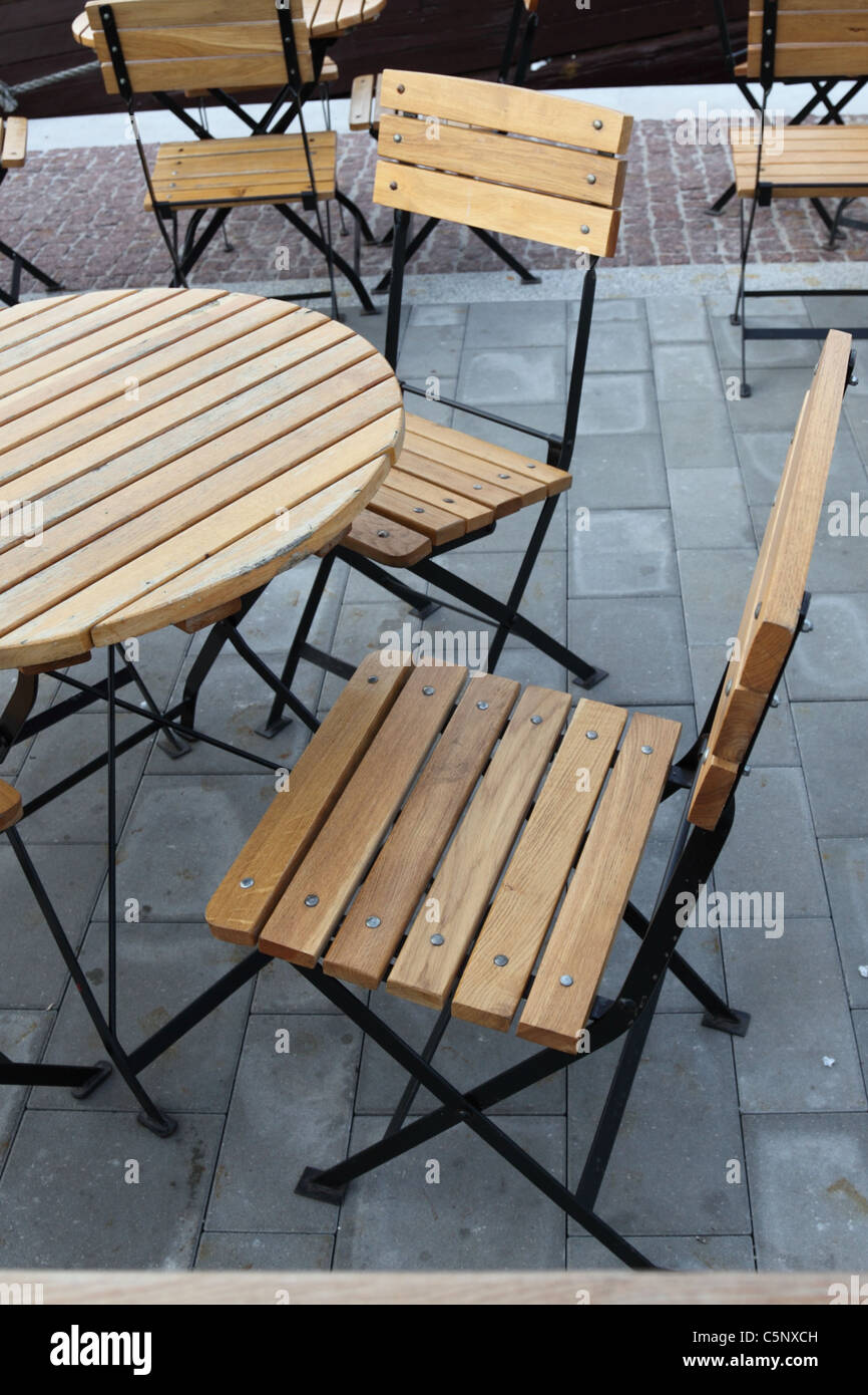 Empty terrace - table and folding chair Stock Photo - Alamy