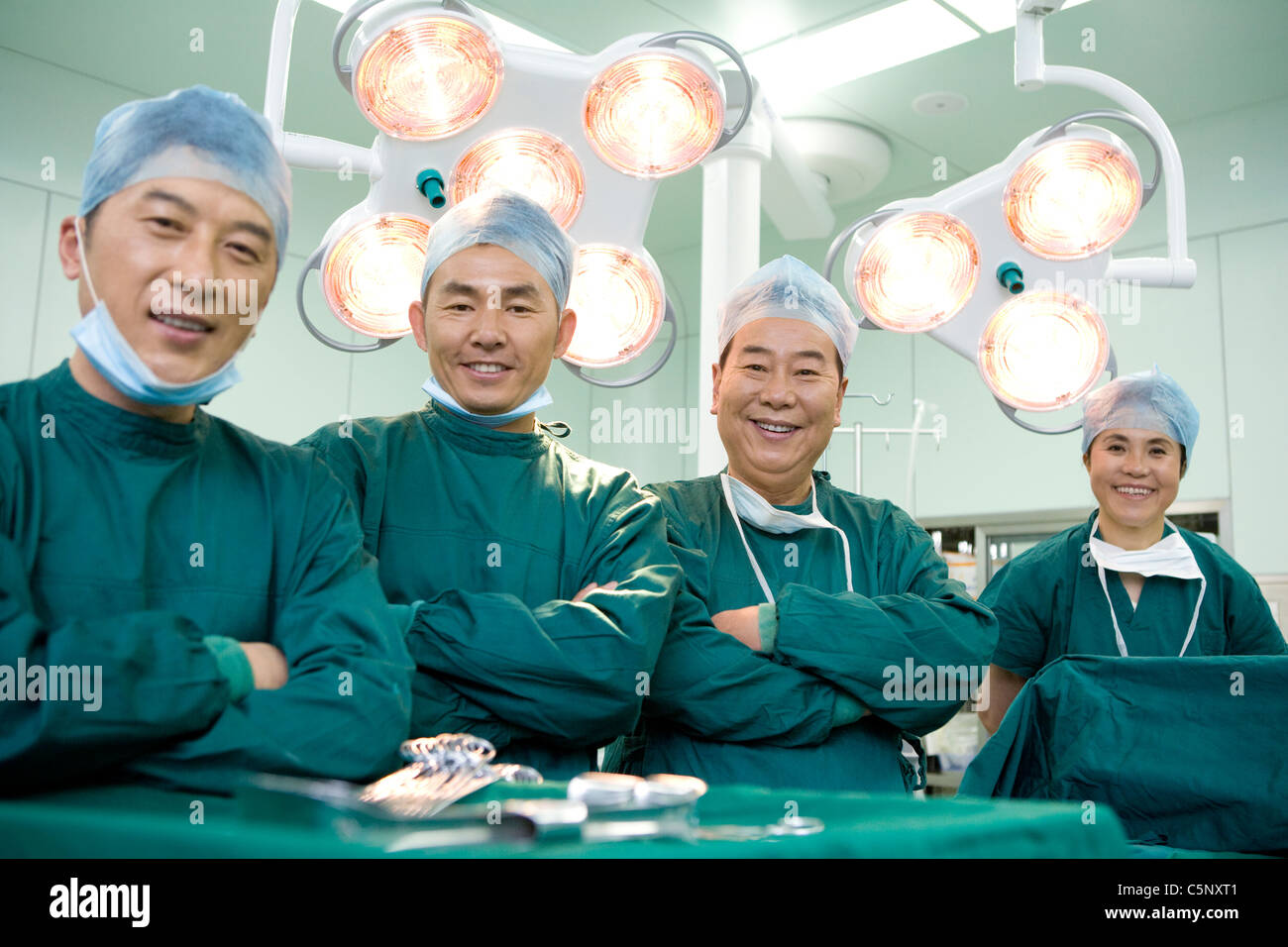 Portrait of a group of happy surgeons Stock Photo - Alamy