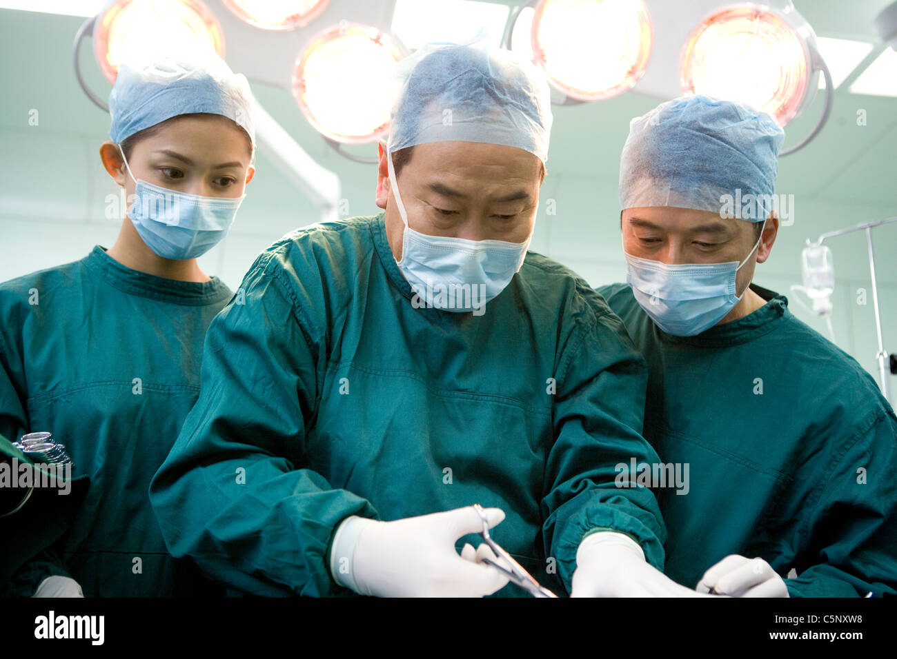 Doctor nurses serious table hi-res stock photography and images - Alamy