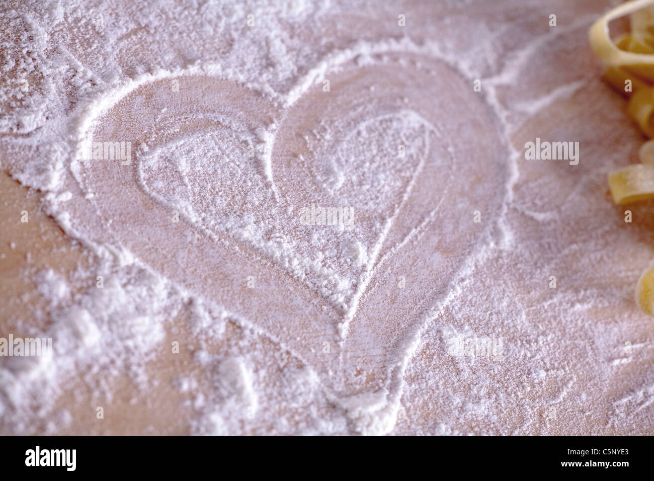 Heart drawn in flour on the board and kid's hands Stock Photo - Alamy