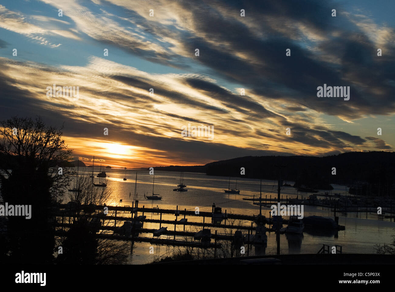 Silhouetted boats on sea, Salt Spring Island, British Columbia, Canada ...