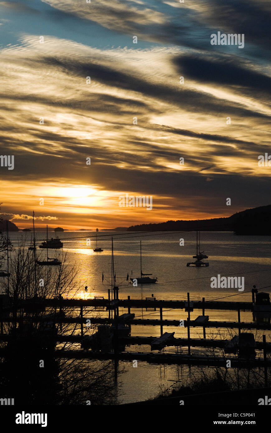 Silhouetted boats on sea, Salt Spring Island, British Columbia, Canada ...