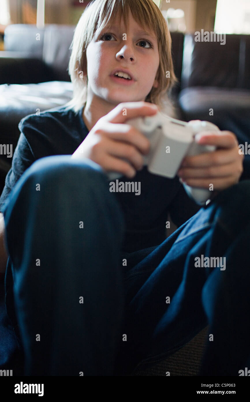 Boy playing video game Stock Photo - Alamy