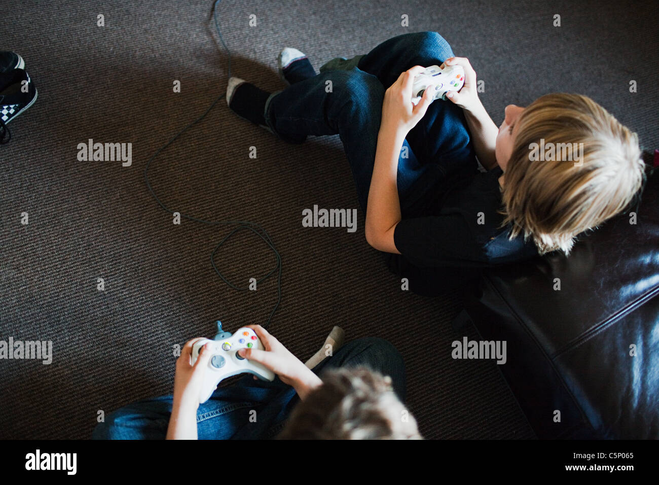 Two boys playing video games Stock Photo - Alamy