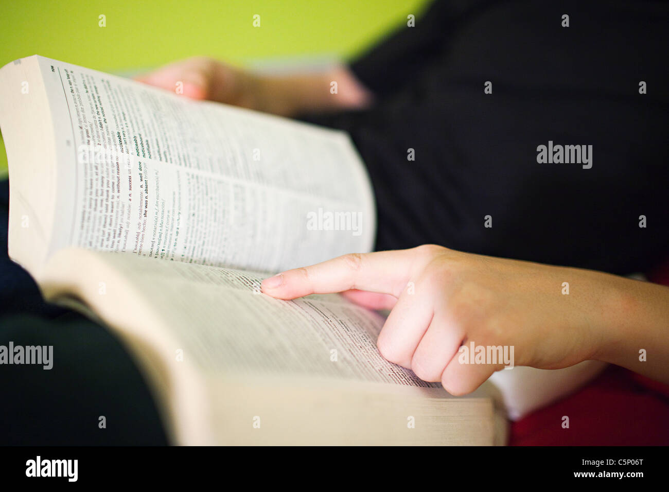 Person reading dictionary Stock Photo - Alamy