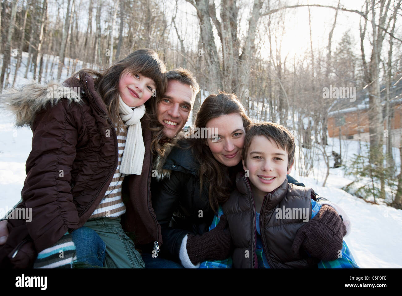 Family in snow, portrait Stock Photo - Alamy