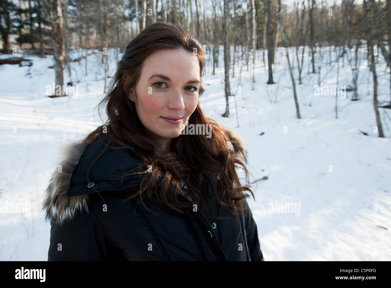 Woman in snow, portrait Stock Photo - Alamy